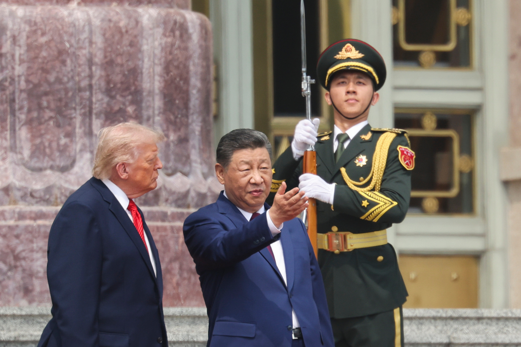 Trump offers friendly words in Beijing while Xi issues cautionary warning
