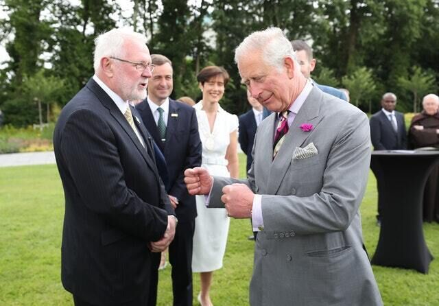 Charles shakes hands with former IRA prisoner and Sinn Féin TD Martin ...