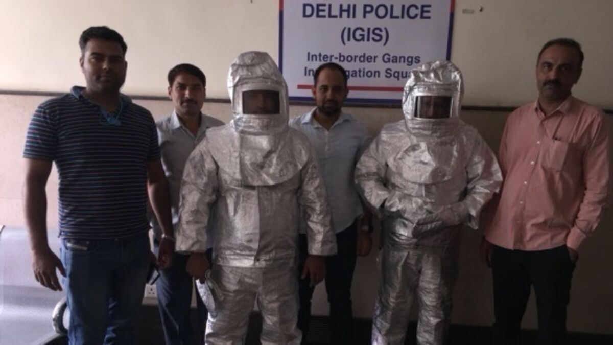Police parade ‘Nasa conmen’ in their 'space suits'