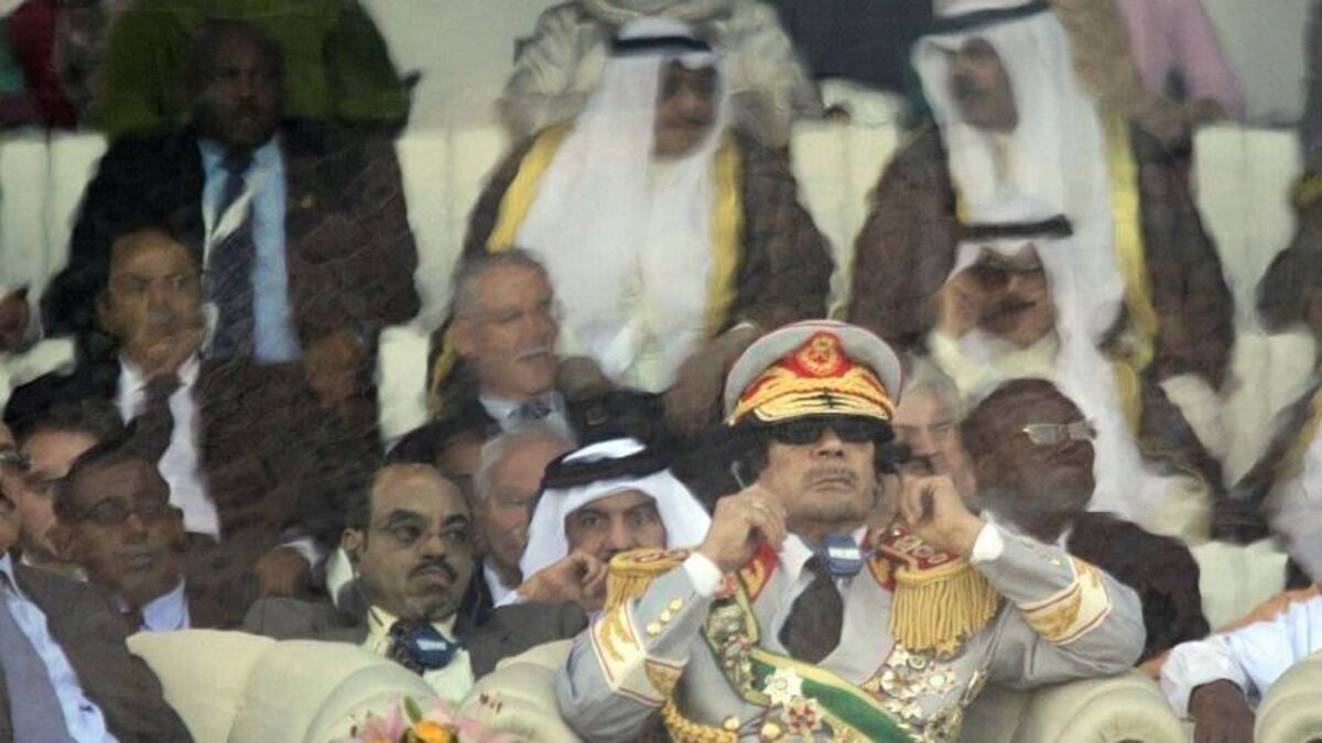 Gaddafi 'buried at dawn'