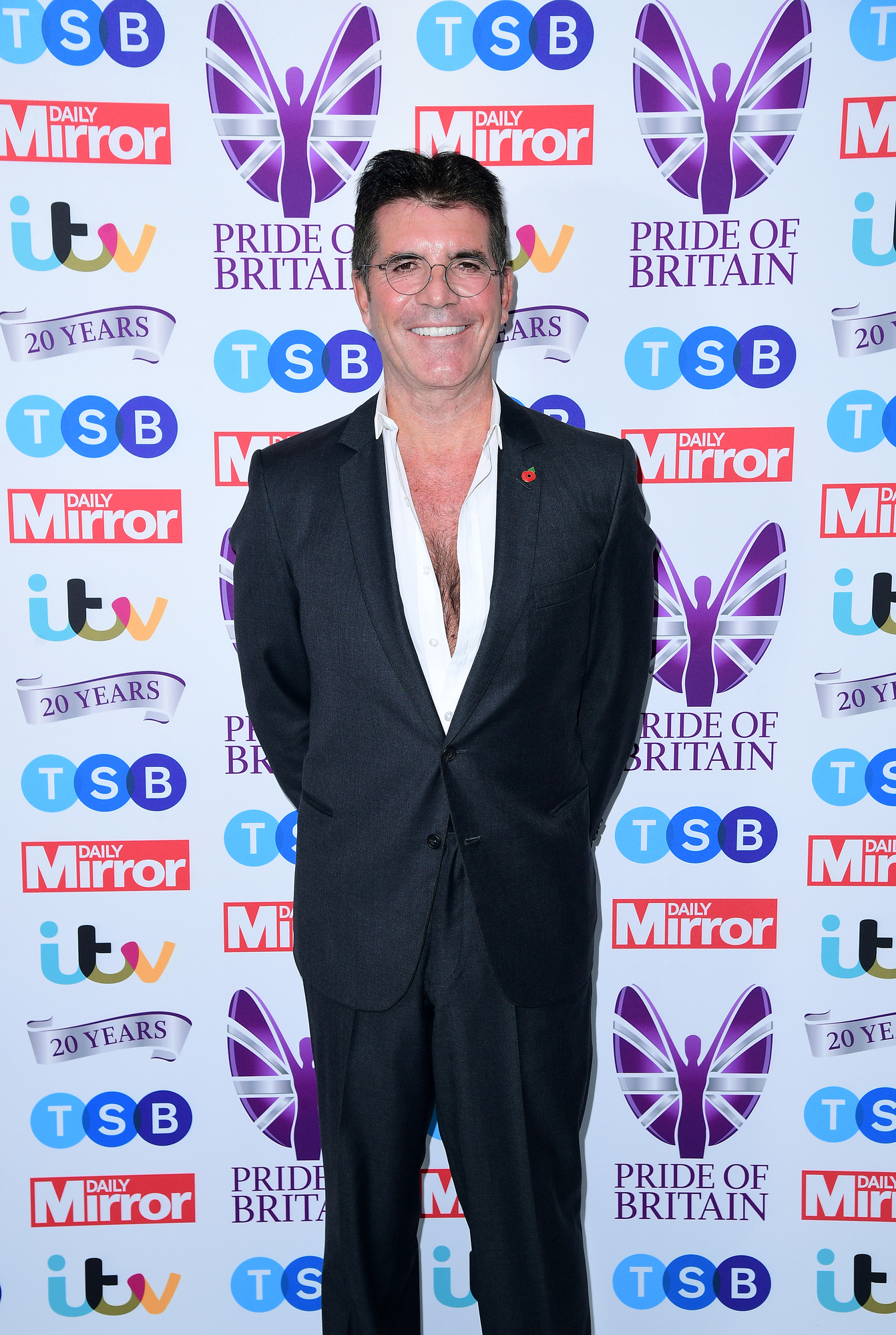 Simon Cowell in hospital after breaking back in bike fall