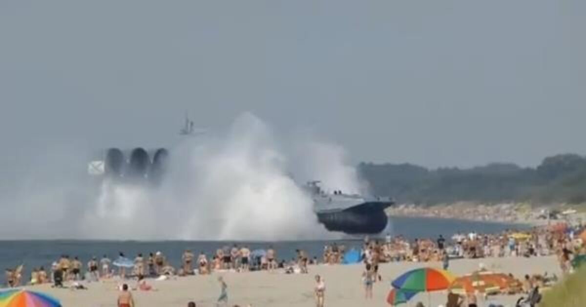 VIDEO: Giant hovercraft powers through hundreds to dock on busy beach
