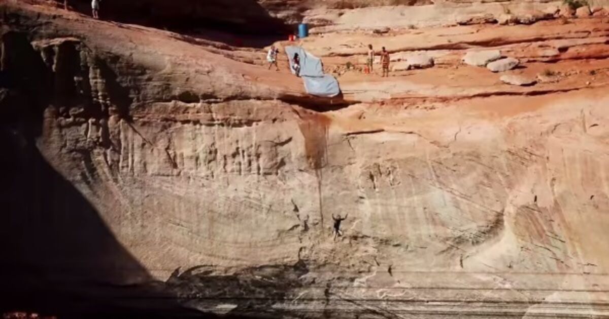 VIDEO: Thrill-seekers make DIY waterslide - off 50-foot cliff