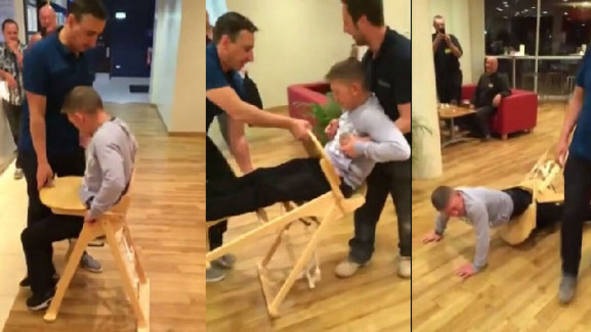 VIDEO: An adult man got himself stuck in a high chair