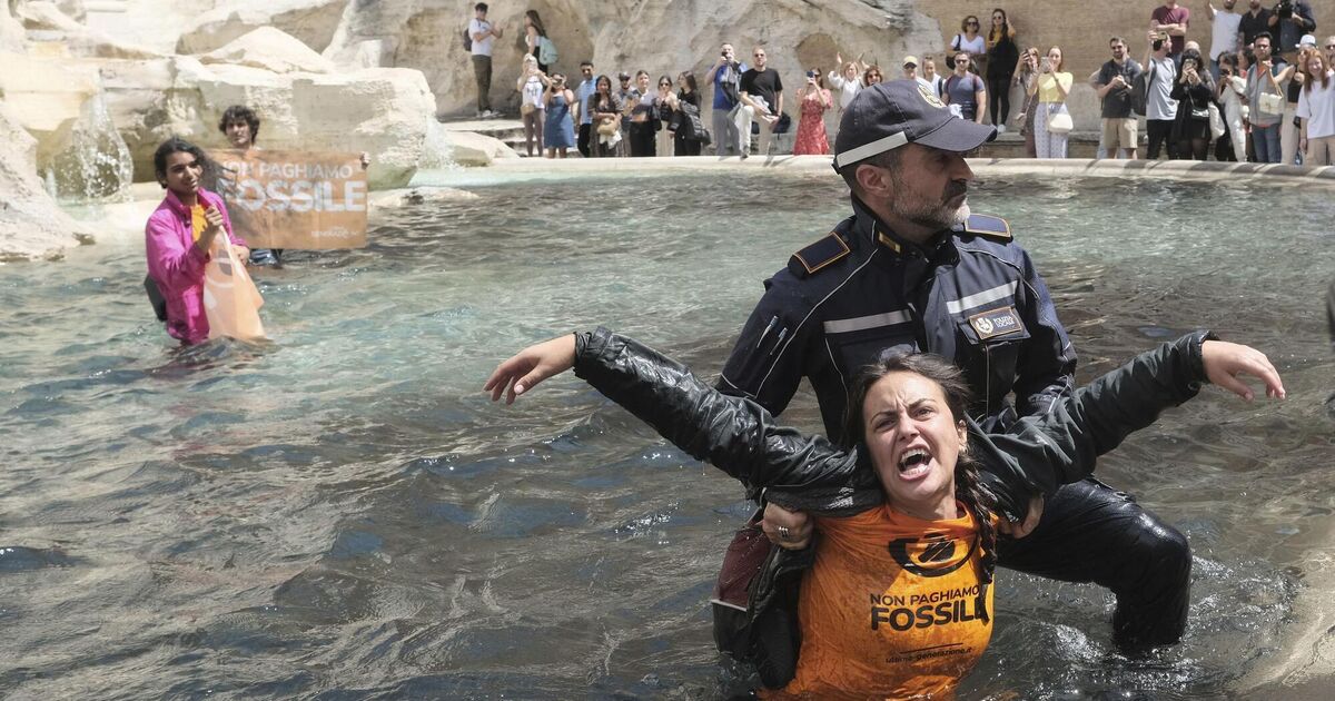 Trevi Fountain water turns black in Rome climate protest