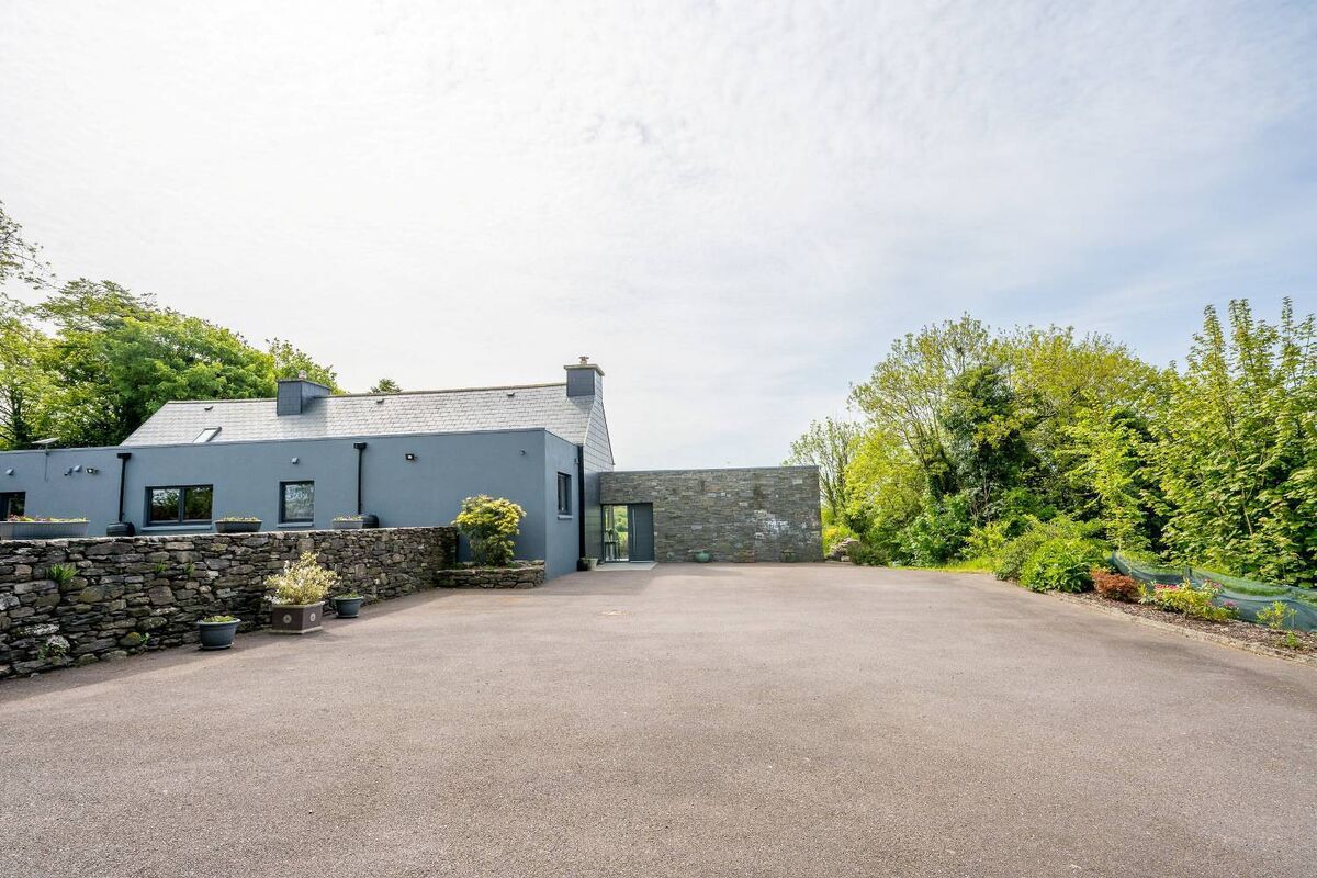 Slate embrace for wrapped-around €465k West Cork farmstead with design edge