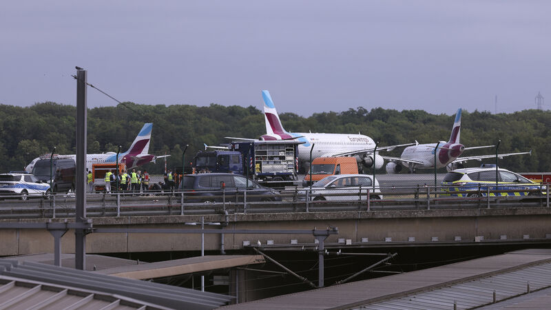 Flights cancelled as climate activists block runway at German airport