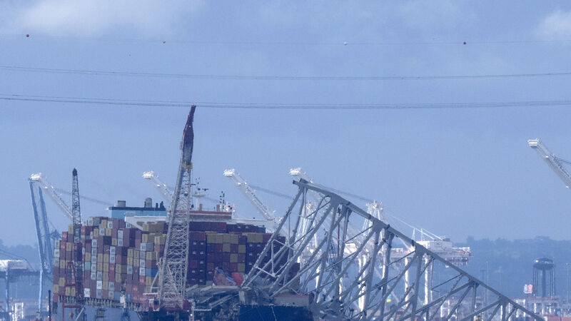 Crews conduct controlled demolition of Baltimore bridge span