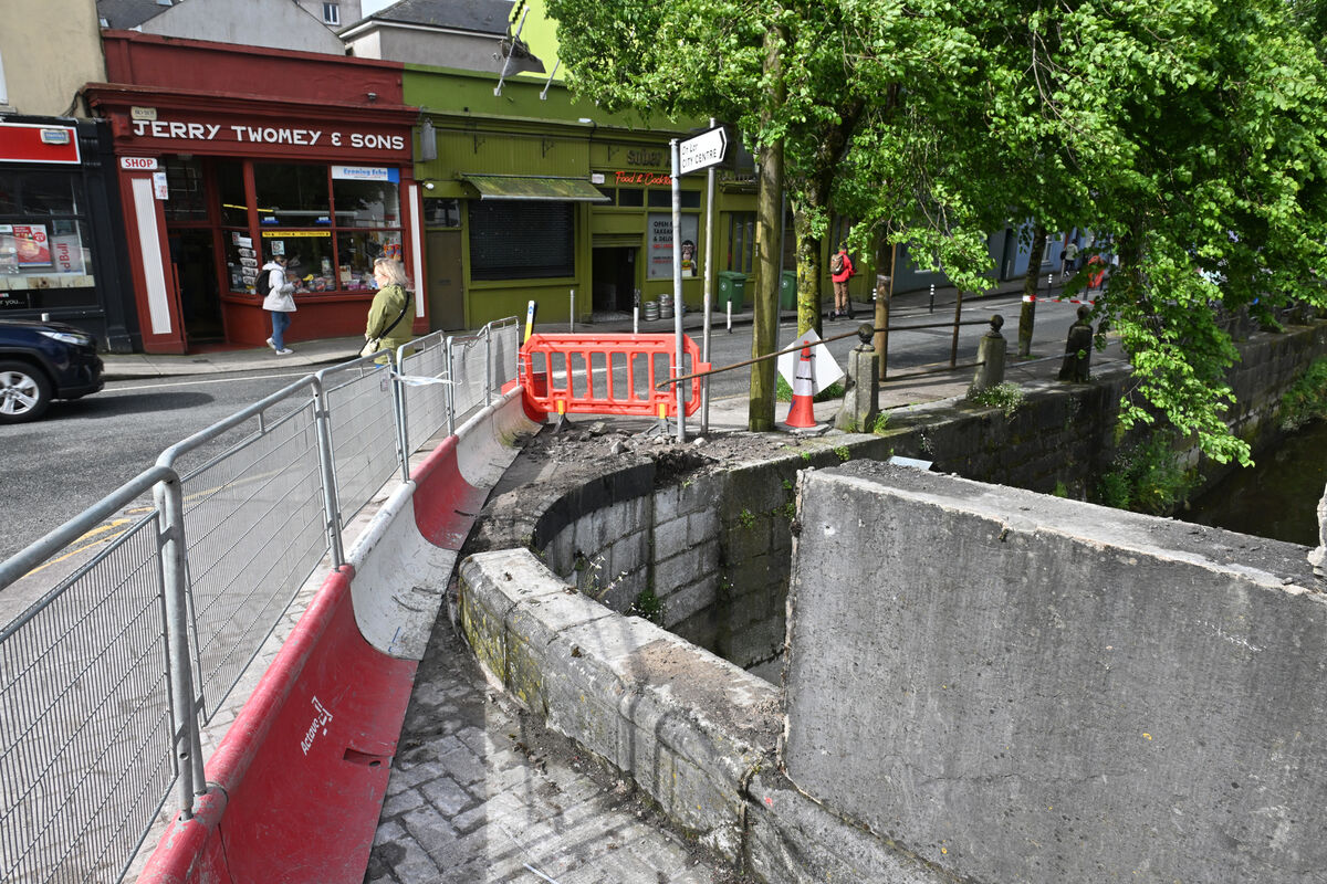 Two hospitalised and section of historic Cork City bridge knocked into ...