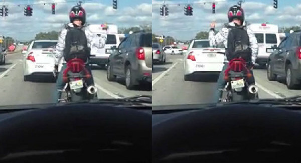 This motorcyclist dancing at the traffic lights is a delight