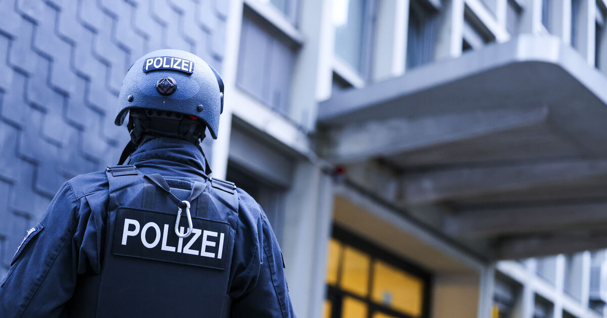 Police detain a suspect in the German knife attack that killed three