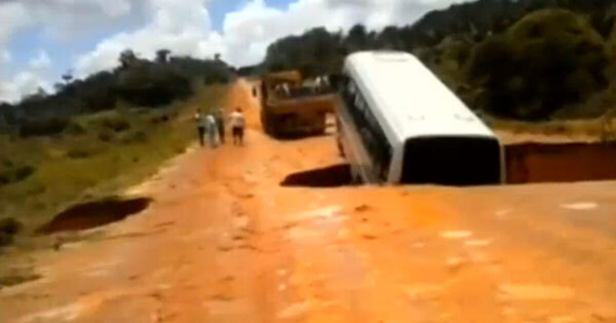 Bus swallowed by sinkhole and swept away by heavy flooding