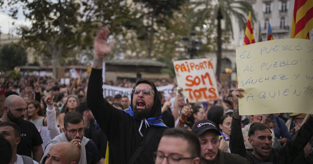 Protesters demand the resignation of Valencia leader over flood response